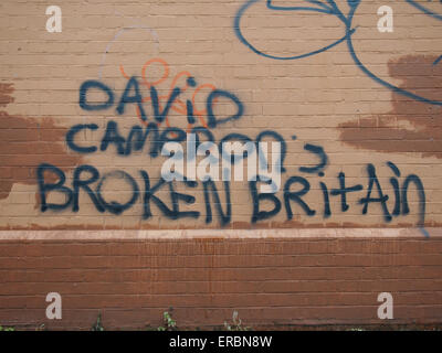 Political spray painted graffiti on a wall, criticizing the corruption ...