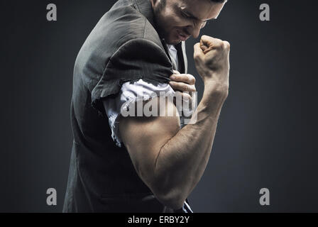 Muscular and handsome athlete making the muscles Stock Photo - Alamy