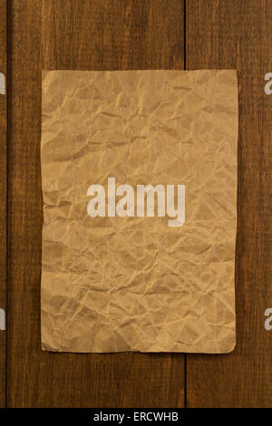 wrinkled note paper on wooden background Stock Photo - Alamy