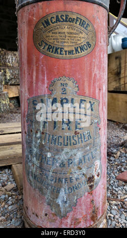 An old Simplex No. 2 fire extinguisher bearing the instruction 'In case ...
