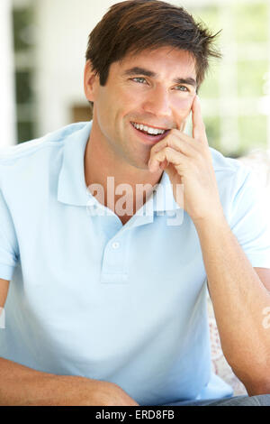 Relaxed young man at home Stock Photo - Alamy