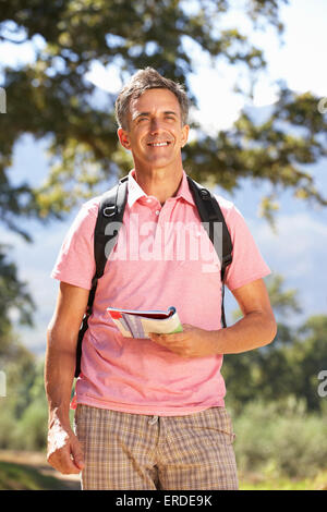 Middle Aged Man Hiking Through Countryside Stock Photo - Alamy