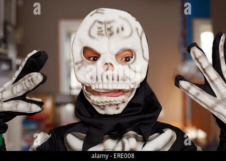 Boy in Halloween skeleton costume Stock Photo - Alamy