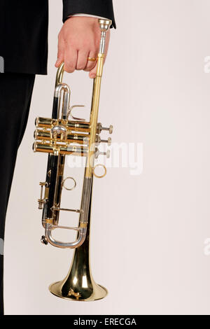 Trumpet being held in one hand, in playing position Stock Photo - Alamy