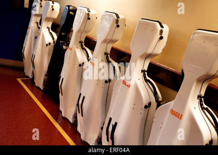 Line of cello cases, flight cases for musical instruments Stock Photo ...