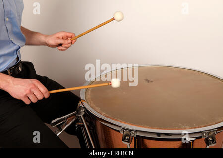 Timpani player playing in the correct playing area of a calf-headed ...