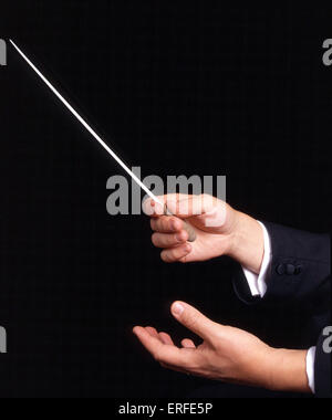Conductors hands pictured, one holding a baton Stock Photo - Alamy