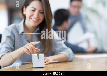 young programmer pointing at digital tablet while working with african ...