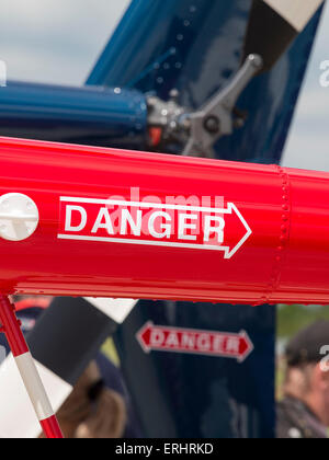 'Danger' warning sign near the tail rotor of a Robinson leisure ...