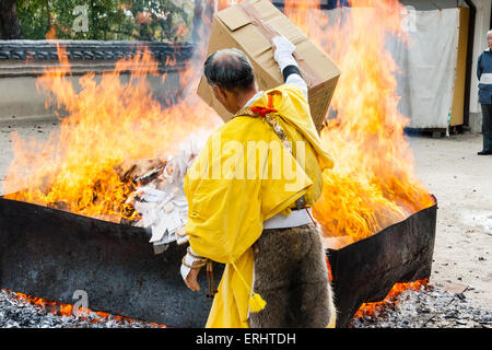 Japan, Nishinomiya, Mondo Yakujin Temple. Yamabushi priest in yellow ...