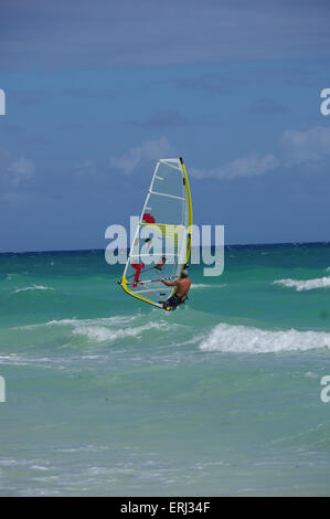Flying the waves windsurfing Stock Photo - Alamy