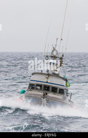 The F/V Glacier Bay, a bristol bay gilnetter, pounds through rough seas ...