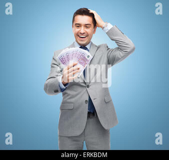 happy laughing businessman with euro money Stock Photo - Alamy
