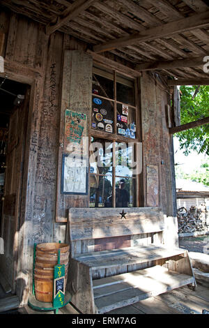 Front porch of an old country store with vintage signs and other ...