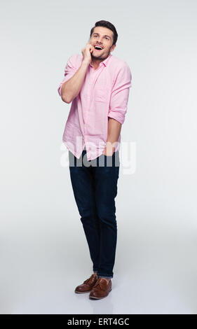 surprised businessman isolated on background Stock Photo - Alamy