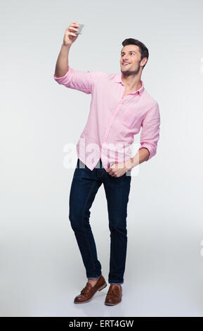 Portrait of a stylish business man making hand gestures. Looking at the ...