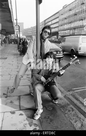 Guitarist Gerry Cott (standing) and bass player Peter Briquette from ...