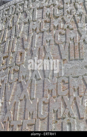A background of Roman numerals and letters set in stone Stock Photo - Alamy