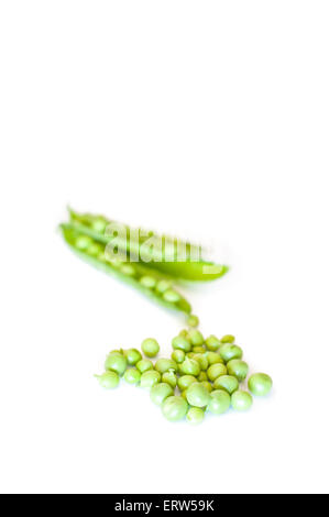 Frame of green pea pods and peas on the kitchen background Stock Photo ...