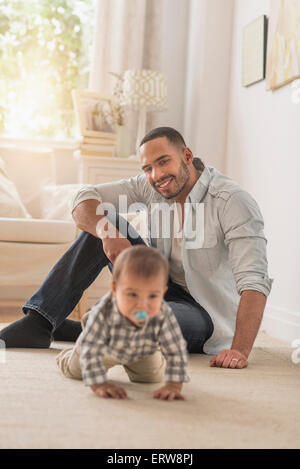 Happy Crawling Baby Boy and Mixed Race Parents Playing in the Park ...