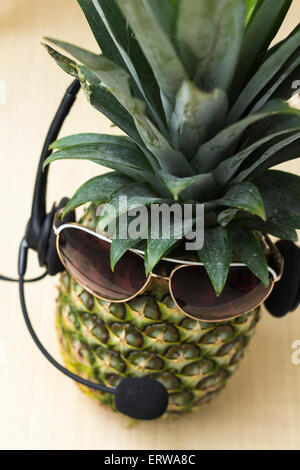 Cool pineapple with sunglasses and headset in summer themed photo Stock ...