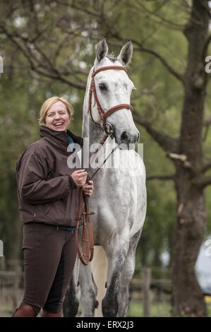 Holstein Horse with woman Stock Photo - Alamy