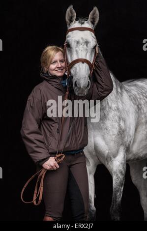 Woman portrait hugs her horse bridle at outdoors ranch Stock Photo - Alamy