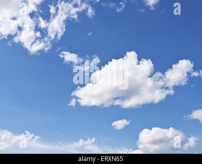 a real blue sky with lots of clouds in the sunny time of the day ...