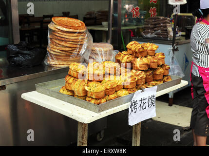 Traditional Chinese baked goods in a bakery display case, Chinatown ...