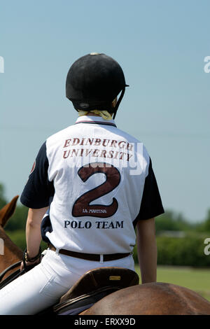 Polo player wearing helmet Stock Photo - Alamy