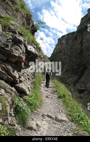 Mountain climbers climbing on the Via Ferrata Marino Bianchi climbing ...