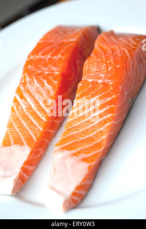 Two fillets raw salmon on isolated white background Stock Photo - Alamy