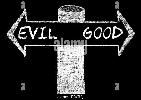 Opposite arrows with Evil versus Good. Hand drawing with chalk on ...