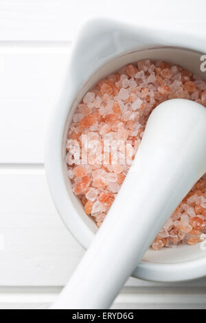 Himalayan pink salt on top of a rock. Selective focus Stock Photo - Alamy