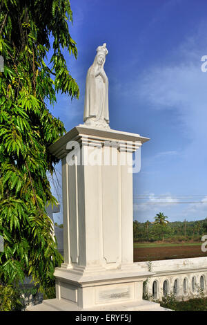 Statue of Mother Mary in front of the catholic church of the shrine of ...