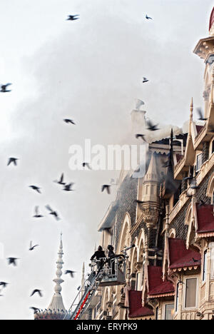 Firefighters try to douse a fire at a hotel in New Delhi, India ...