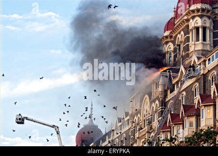 Fire fighters try to douse fire of Taj Mahal hotel after terrorist ...