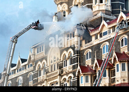Firefighters try to douse a fire at a hotel in New Delhi, India ...