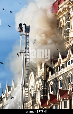 Firefighters try to douse a fire at a hotel in New Delhi, India ...