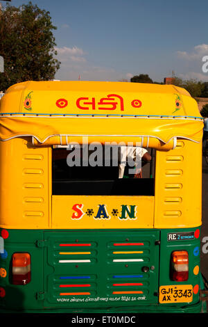 Yellow auto rickshaw parked on side of road in Chennai, India Stock ...