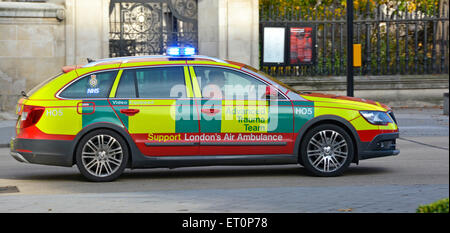 Advanced Trauma Team in NHS emergency car speeding to a 999 call for ...