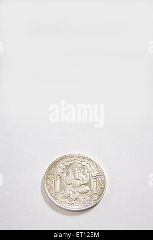 Concept, silver coin of god ganesh on white background Stock Photo - Alamy