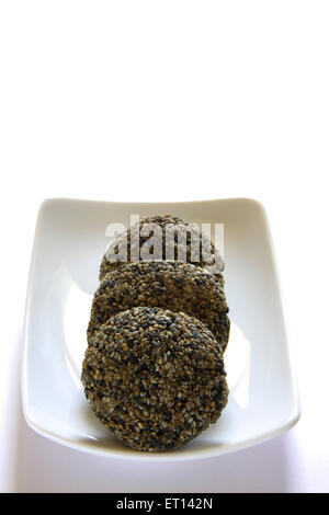Indian sweet , Tilgur ladoo, tilgul ladoo, black sesame seeds ladoo, in ...