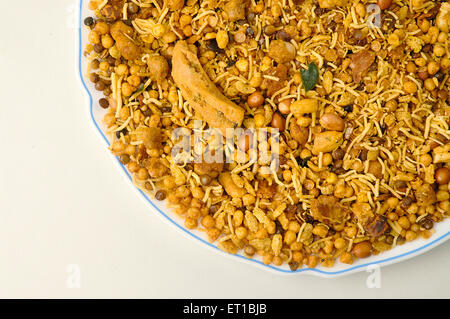 Indian namkeen snacks served in ceramic white bowl no white background ...