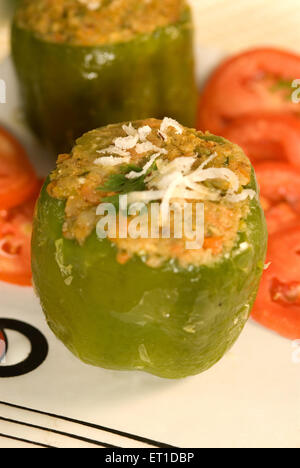 Stuff capsicum garnish with coriander leaves and grated coconut Stock ...