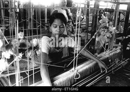 Bodo tribe tribal woman weaving on handloom ; Assam ; India ; Asia ...