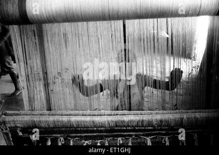 Bodo tribe tribal woman weaving on handloom ; Assam ; India ; Asia ...