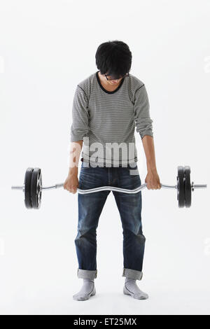 Young Men Doing Heavy Barbell Exercise Stock Photo - Alamy