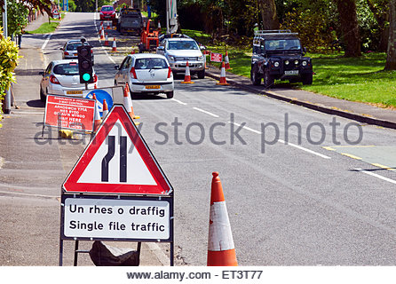 A single file traffic sign warning of a contra flow in roadworks in ...