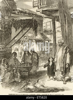 India, Kashmir, Srinagar, bazaar, man wearing Pheran, traditional ...